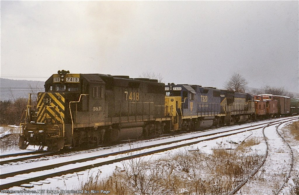 D&H GP39-2 7418 couples on to GP38-2 7320 and U23B 2310